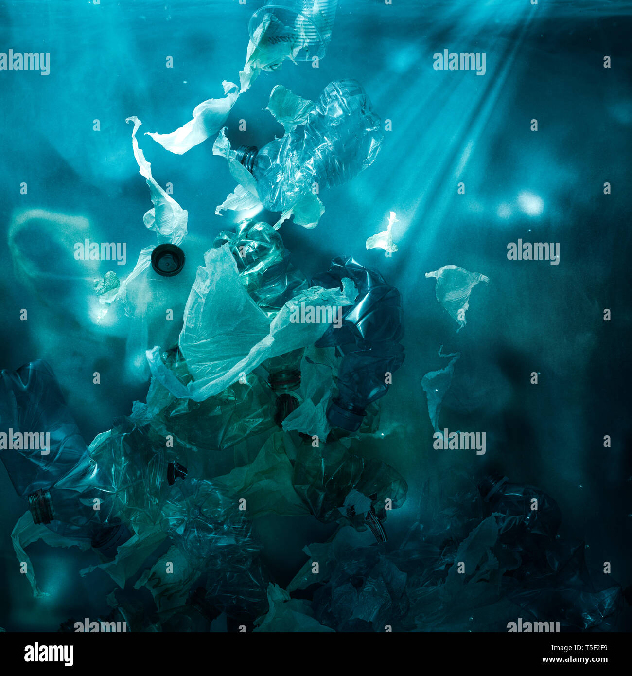 Toxic plastic waste floating underwater in the ocean, water pollution ...