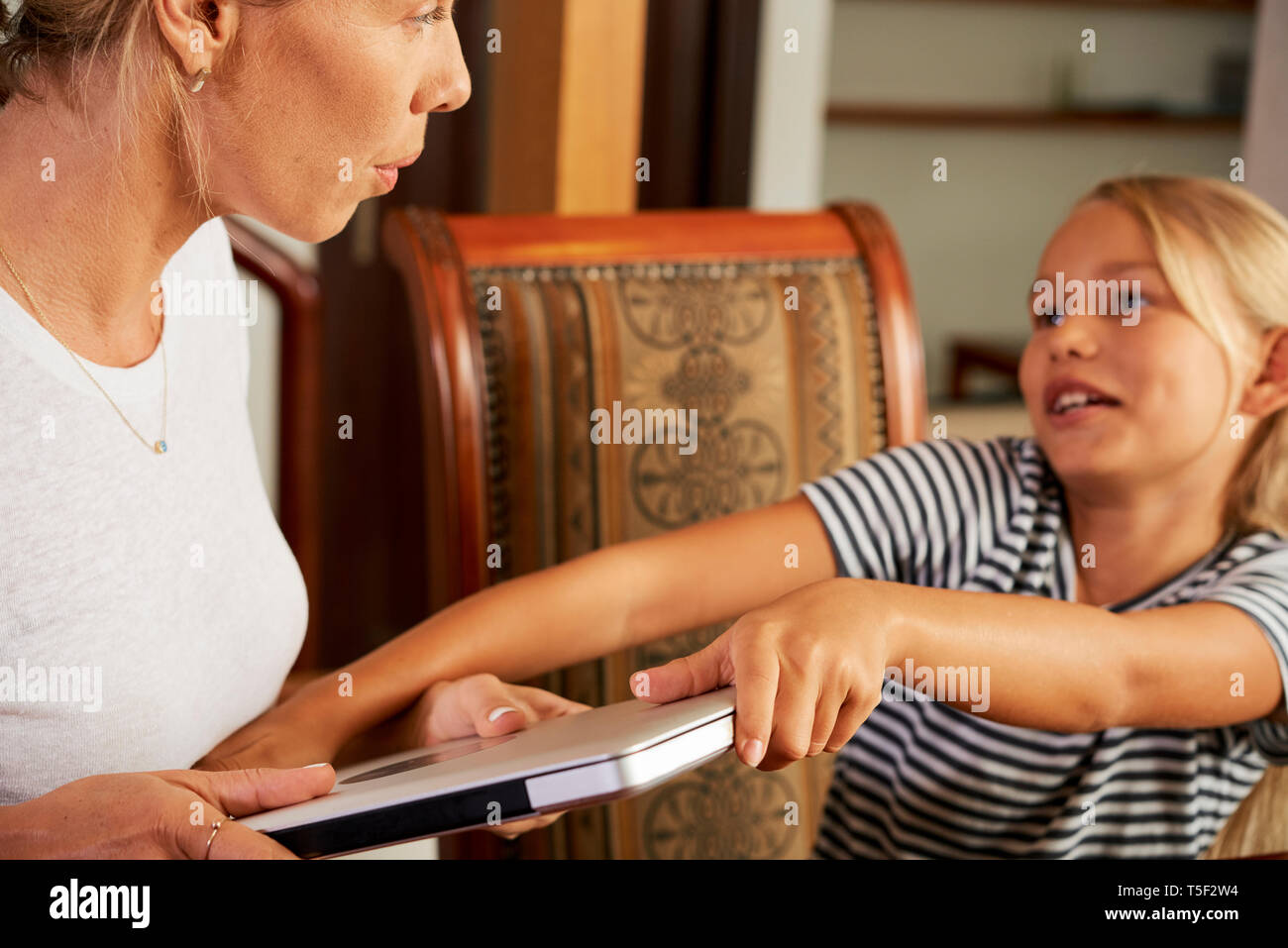 Child pulling mother hi-res stock photography and images - Alamy