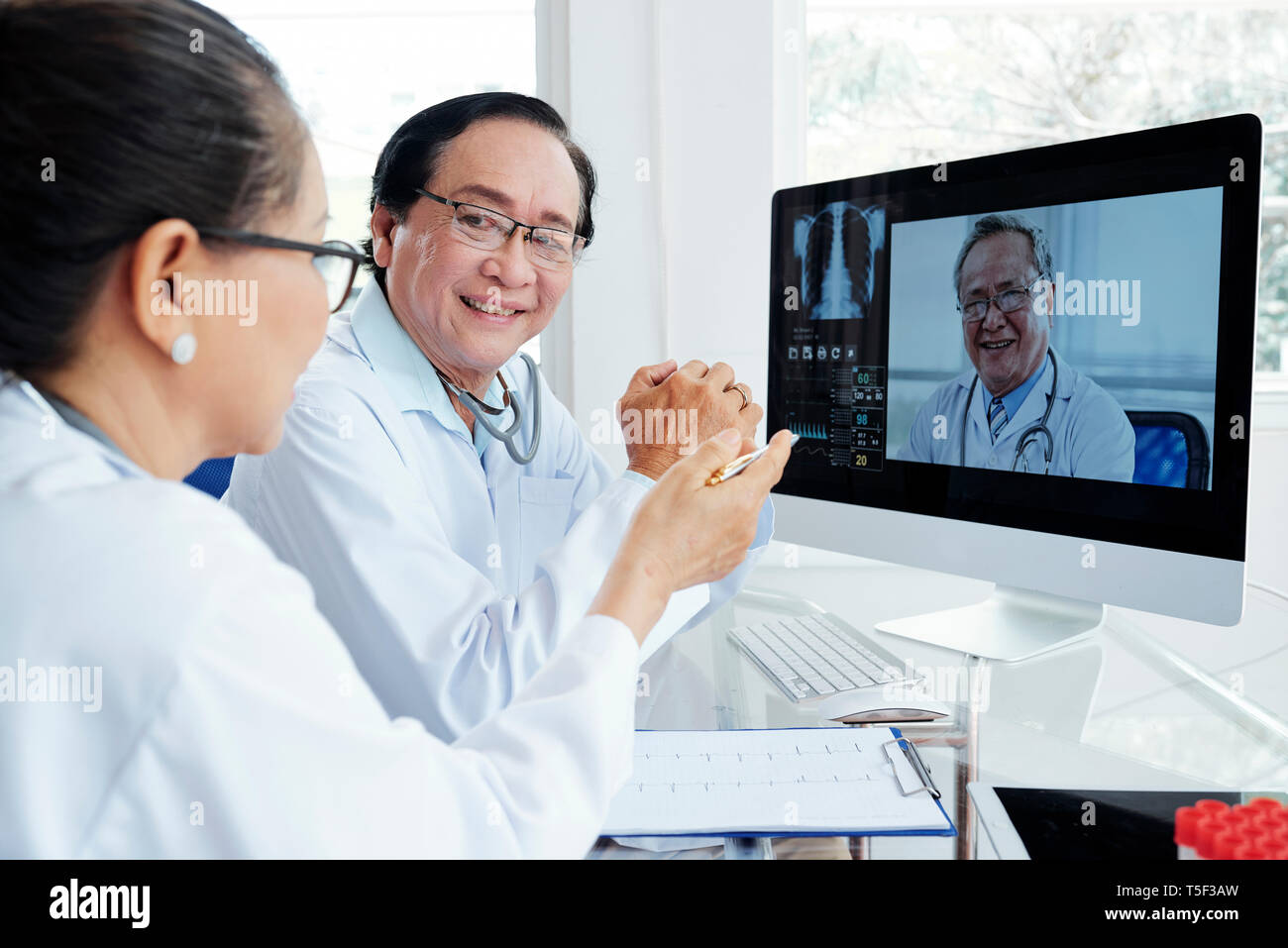 Medical workers having video conference Stock Photo - Alamy