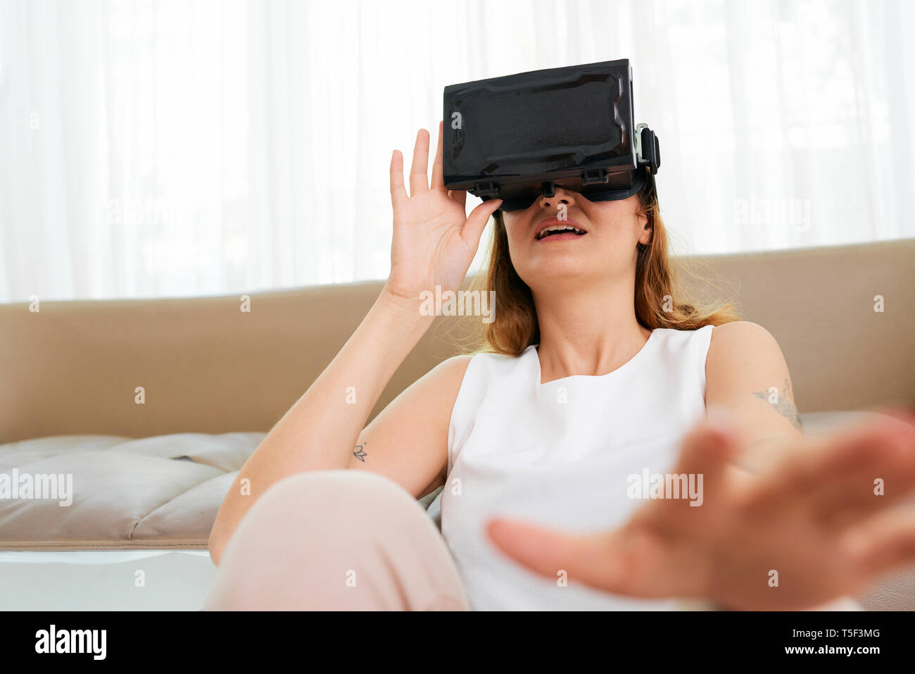 Woman wearing vr glasses in hi-res stock photography and images - Alamy
