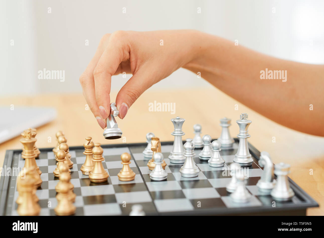 Hand playing chess hi-res stock photography and images - Alamy