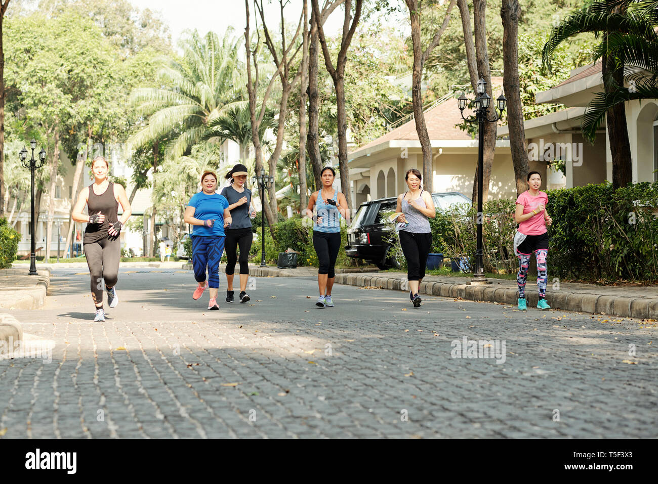 Women jogging in the street Stock Photo - Alamy