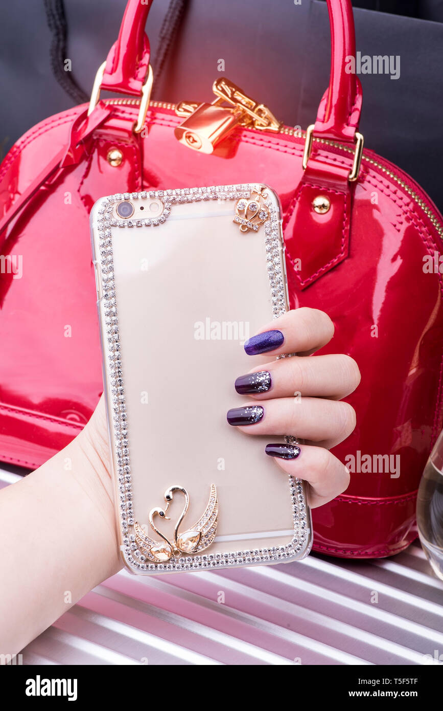 Female hand pink nails holding hi-res stock photography and images - Alamy