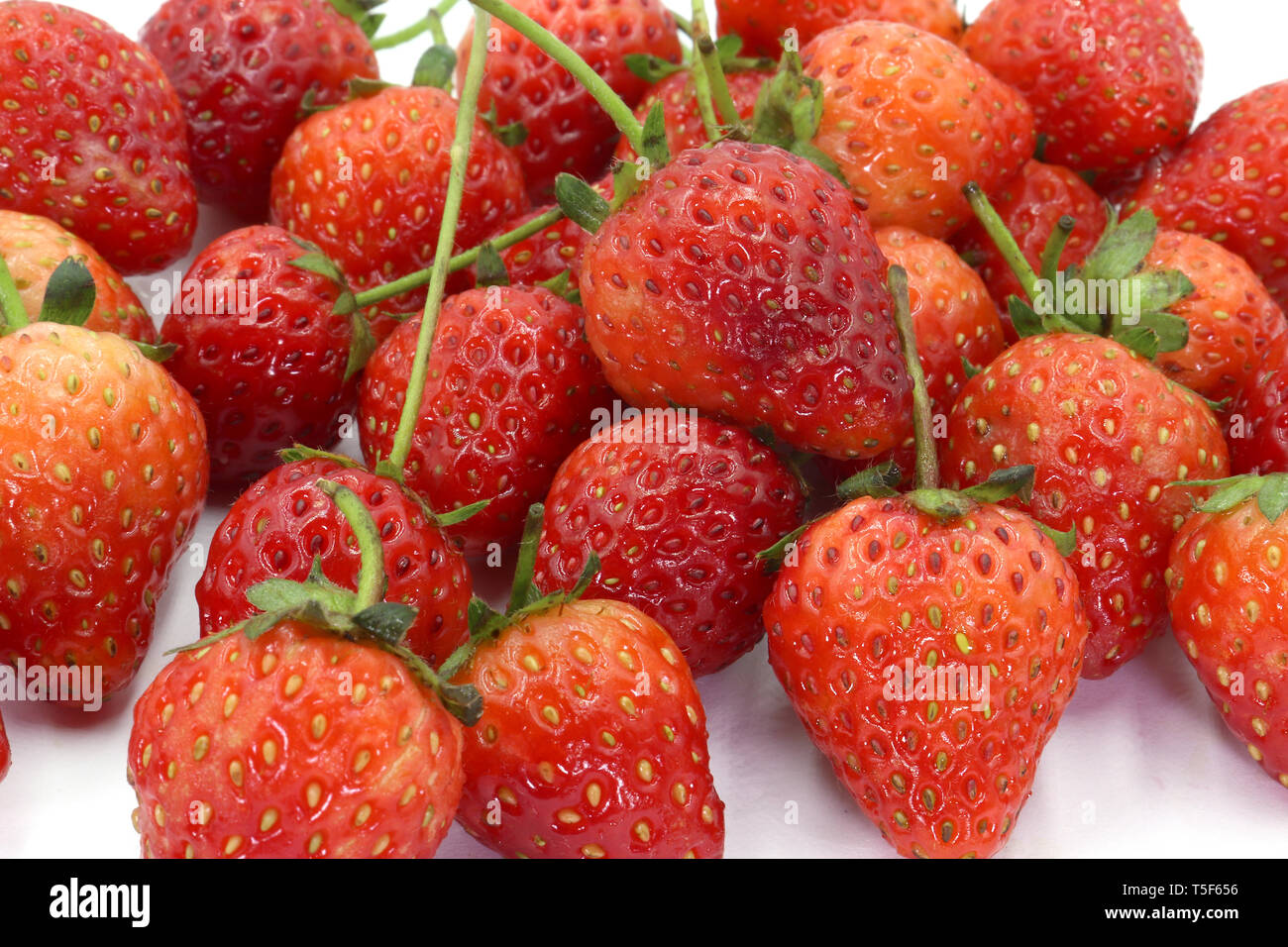 strawberries ,small strawberry with strawberry leaf on white background ...
