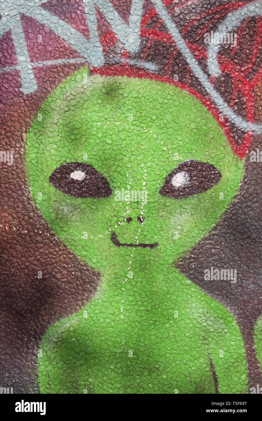 painted alien on a wall in Berlin, Germany Stock Photo - Alamy