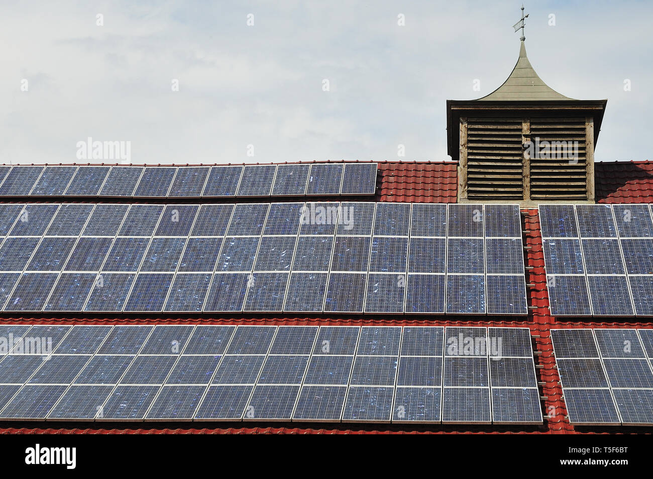 solar panels on roof of old building with wooden turret on top Stock ...