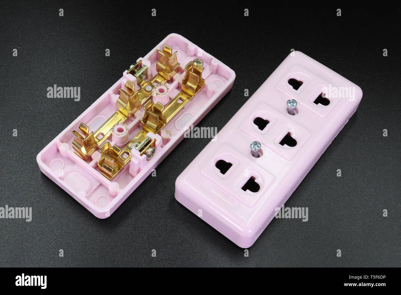 power outlet adapter what's inside, isolated on black studio background ...