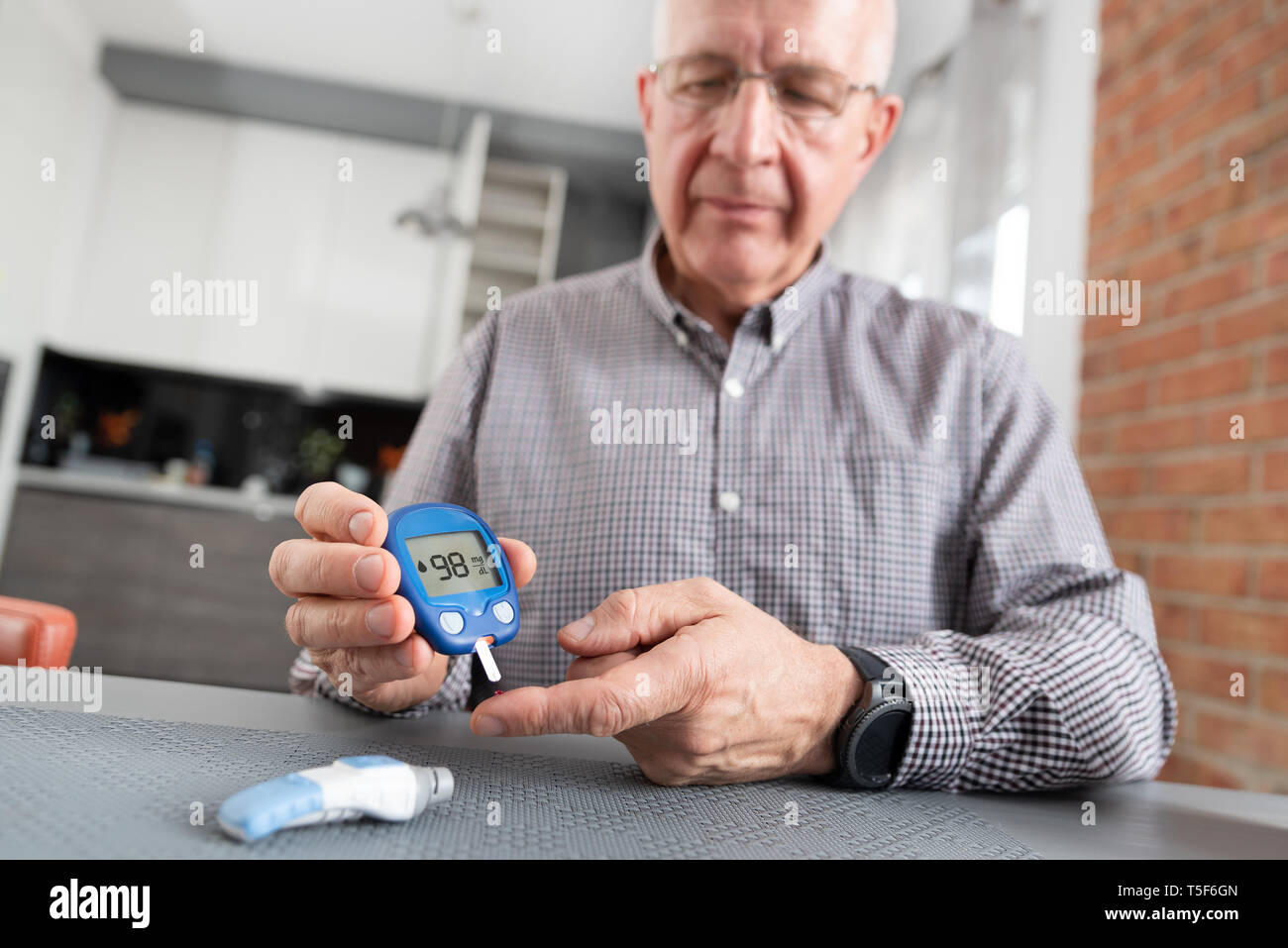 Home glucose monitor male hi-res stock photography and images - Alamy