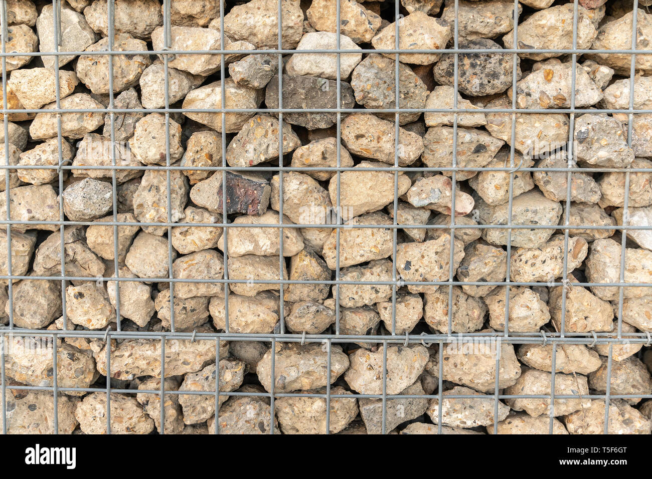 Detail of Wall building blocks with mesh wire stone basket Stock Photo ...