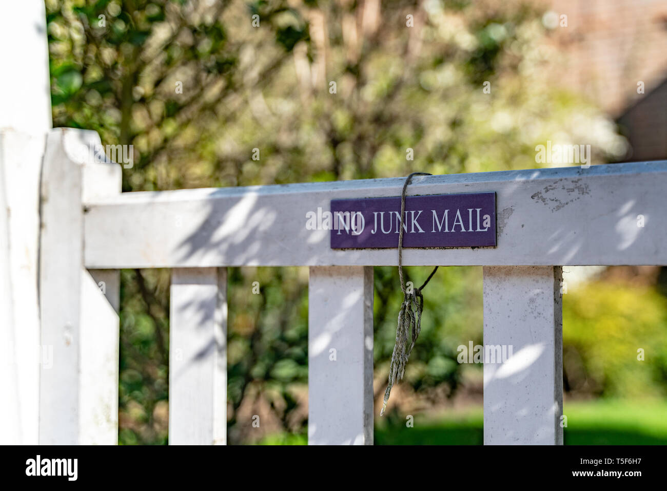 No Junk Mail sign on the garden gate of a typical English residential ...