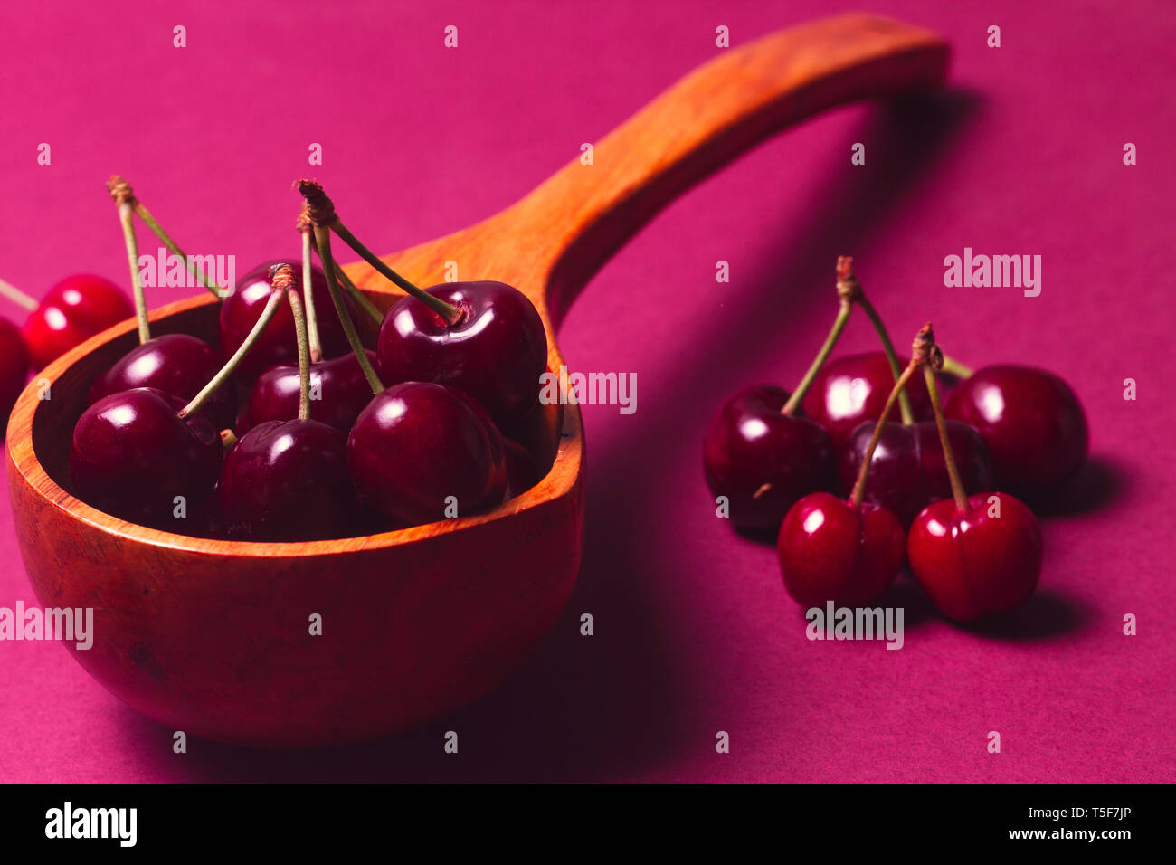 seasonal red fruits on a background of the same color Stock Photo - Alamy