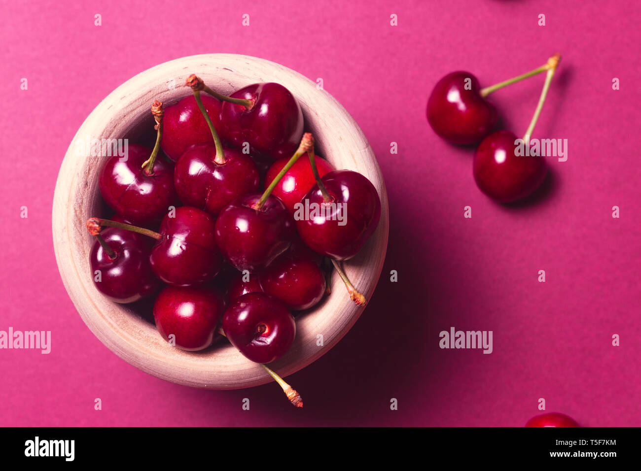 seasonal red fruits on a background of the same color Stock Photo - Alamy
