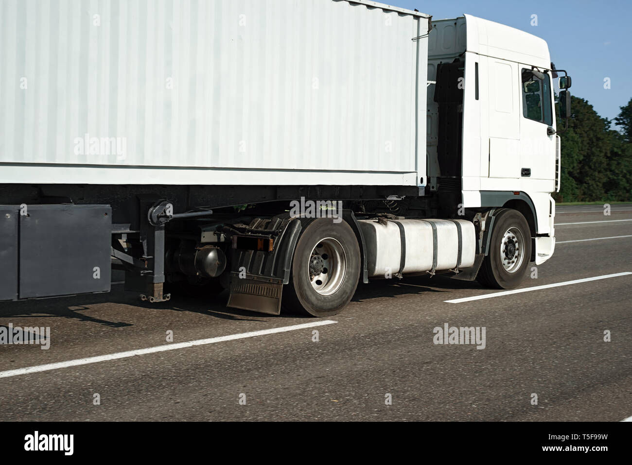 Truck is going along the road. Cargo transportation concept Stock Photo ...