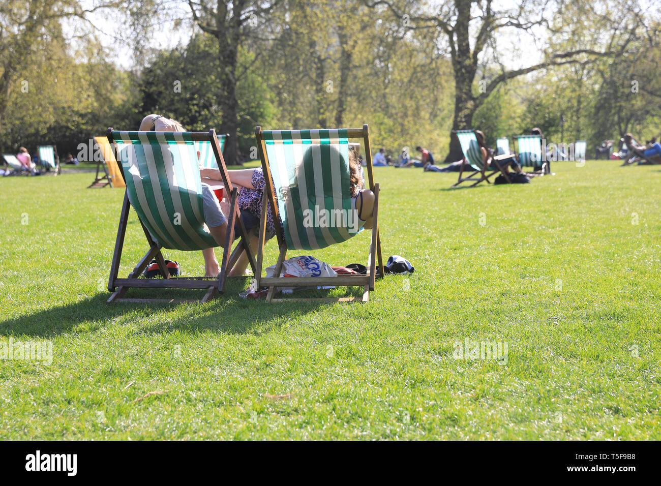 Relaxing in the spring sunshine in St James's Royal Park, in central ...