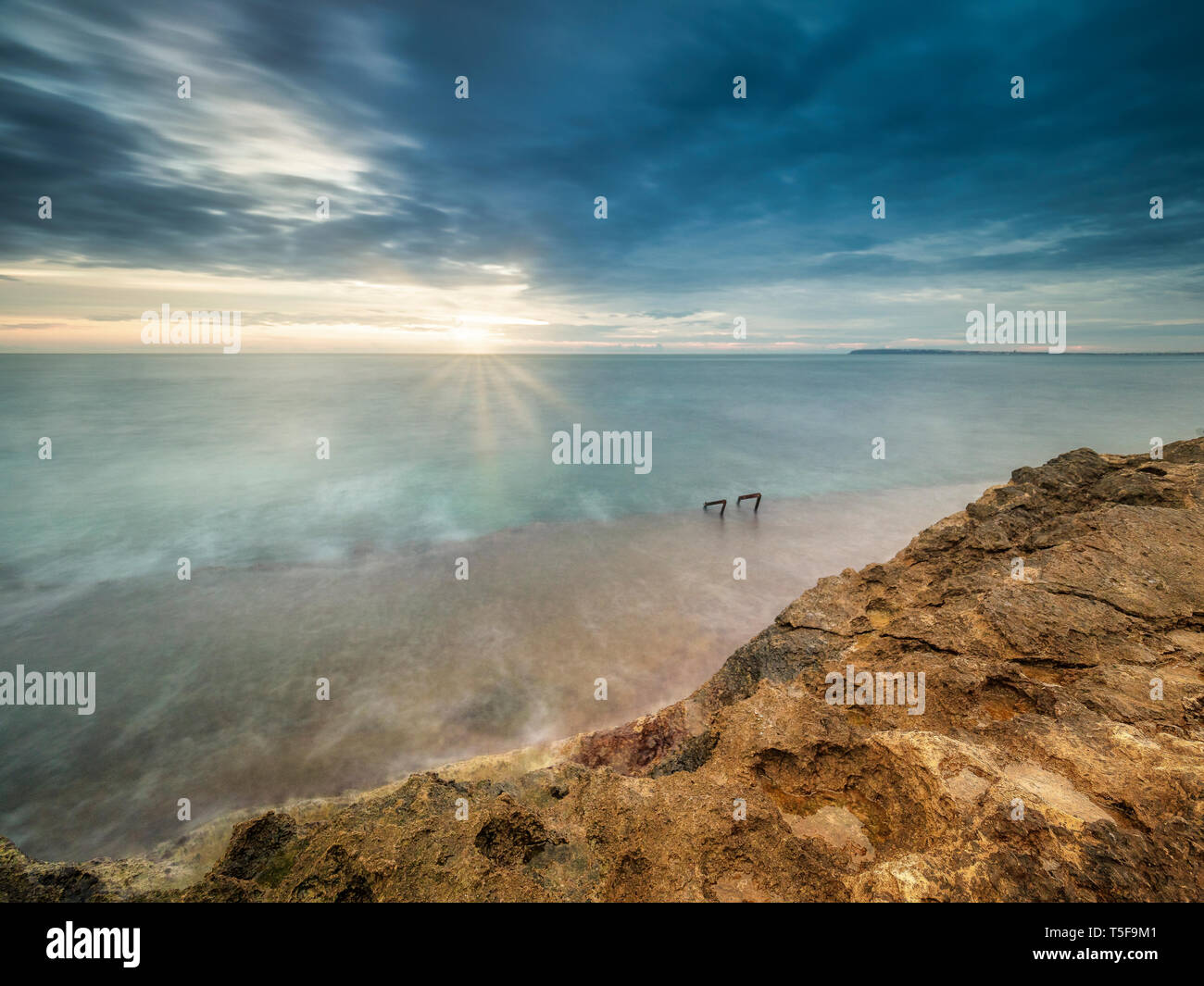 Last ray of light in stairway of Cala Cantalar . Seascape Stock Photo ...