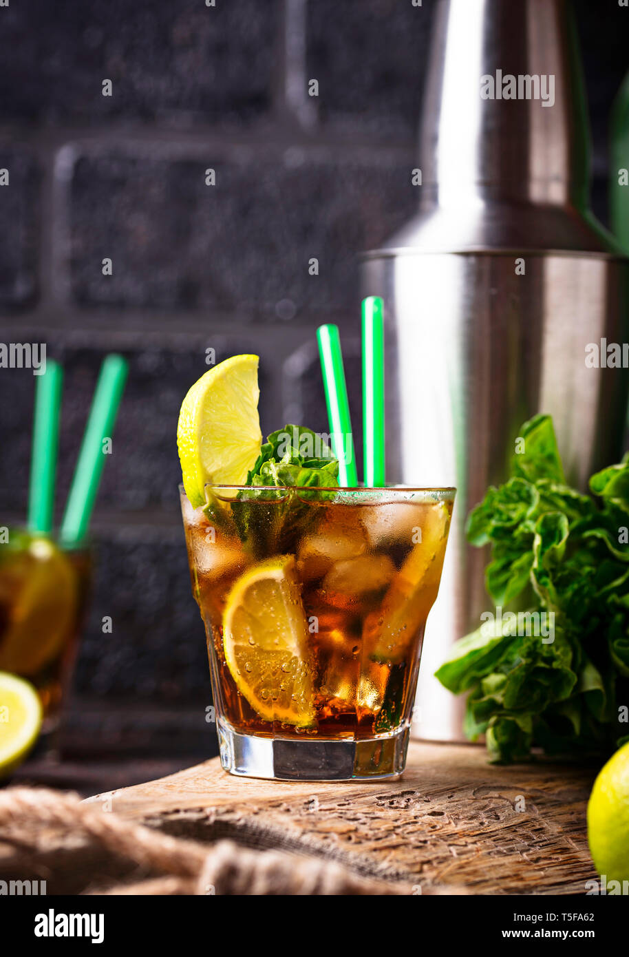 Cuba libre cocktail with mint and lime Stock Photo - Alamy