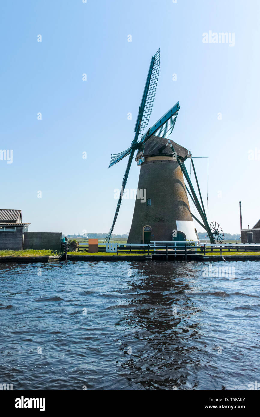 Waterways of North Holland and view on traditional Dutch wind mill ...
