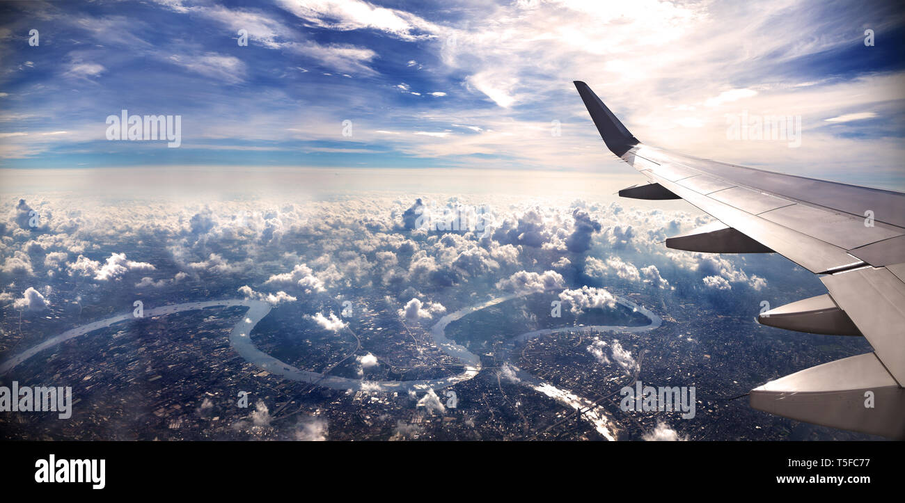 Airplane Flying In Sunset