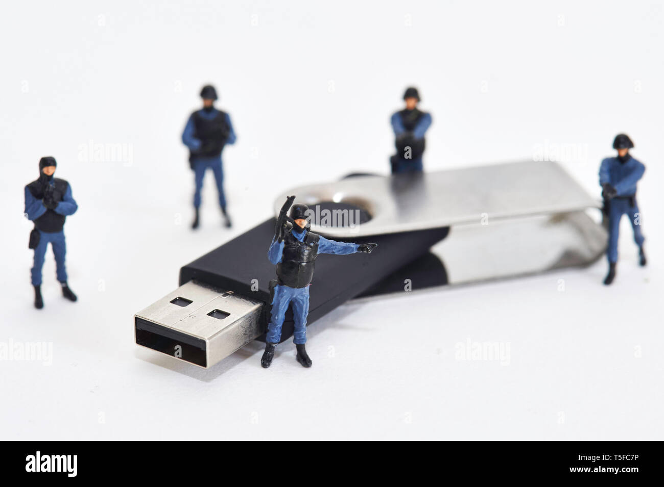 Figurines surrounding an USB stick: data protection and information ...