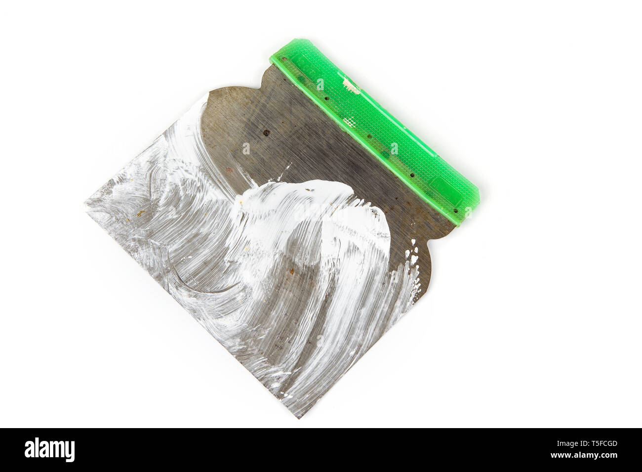 Dirty spatula for plastering or car repair Stock Photo - Alamy