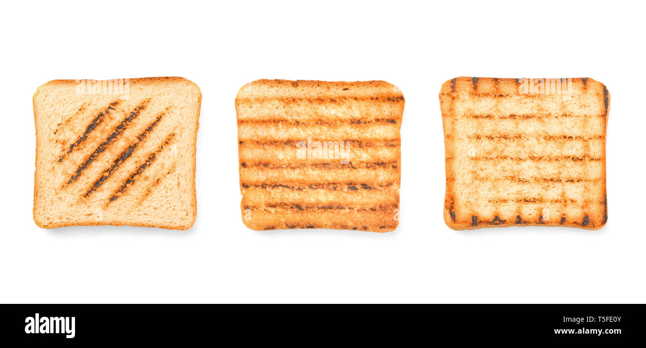 Different tasty toasted bread on white background Stock Photo - Alamy