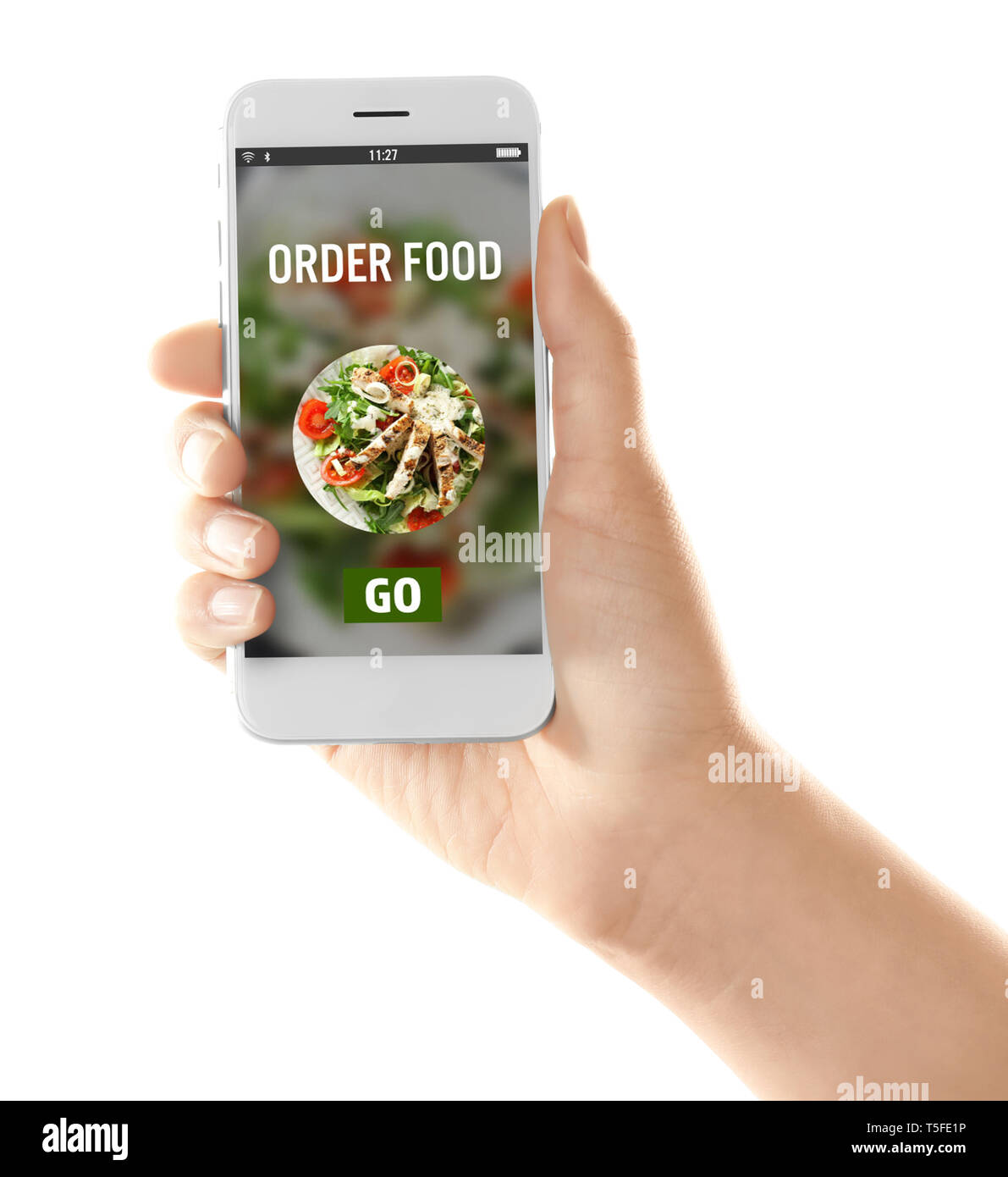 Woman holding mobile phone with open page of food delivery service on ...