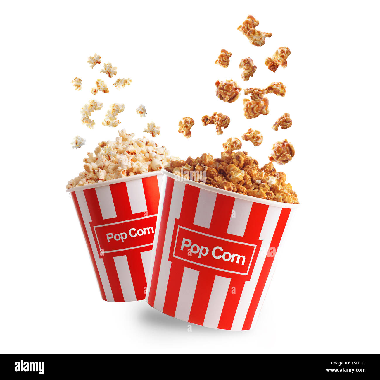 Tasty popcorn falling into cups on white background Stock Photo - Alamy