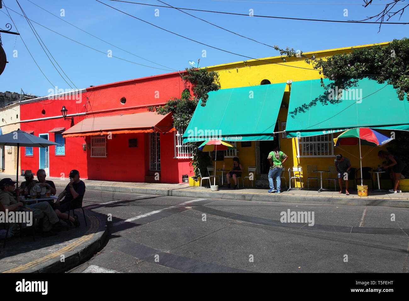 Colourful painted shop-fronts in the Plaza de Trinidad, Getsemani ...