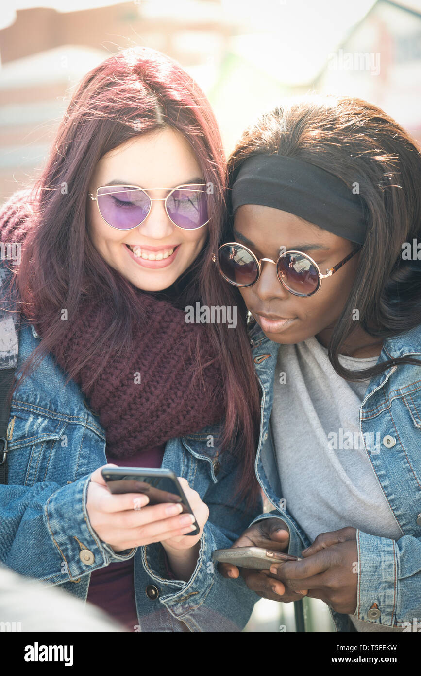 group of three student two females and a male student doing a selfie ...