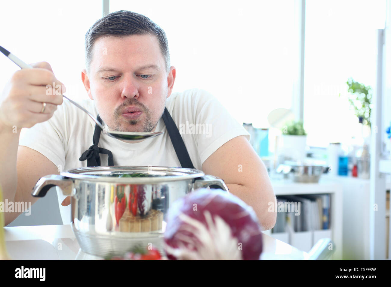 Professional chef holding saucepan hi-res stock photography and images ...