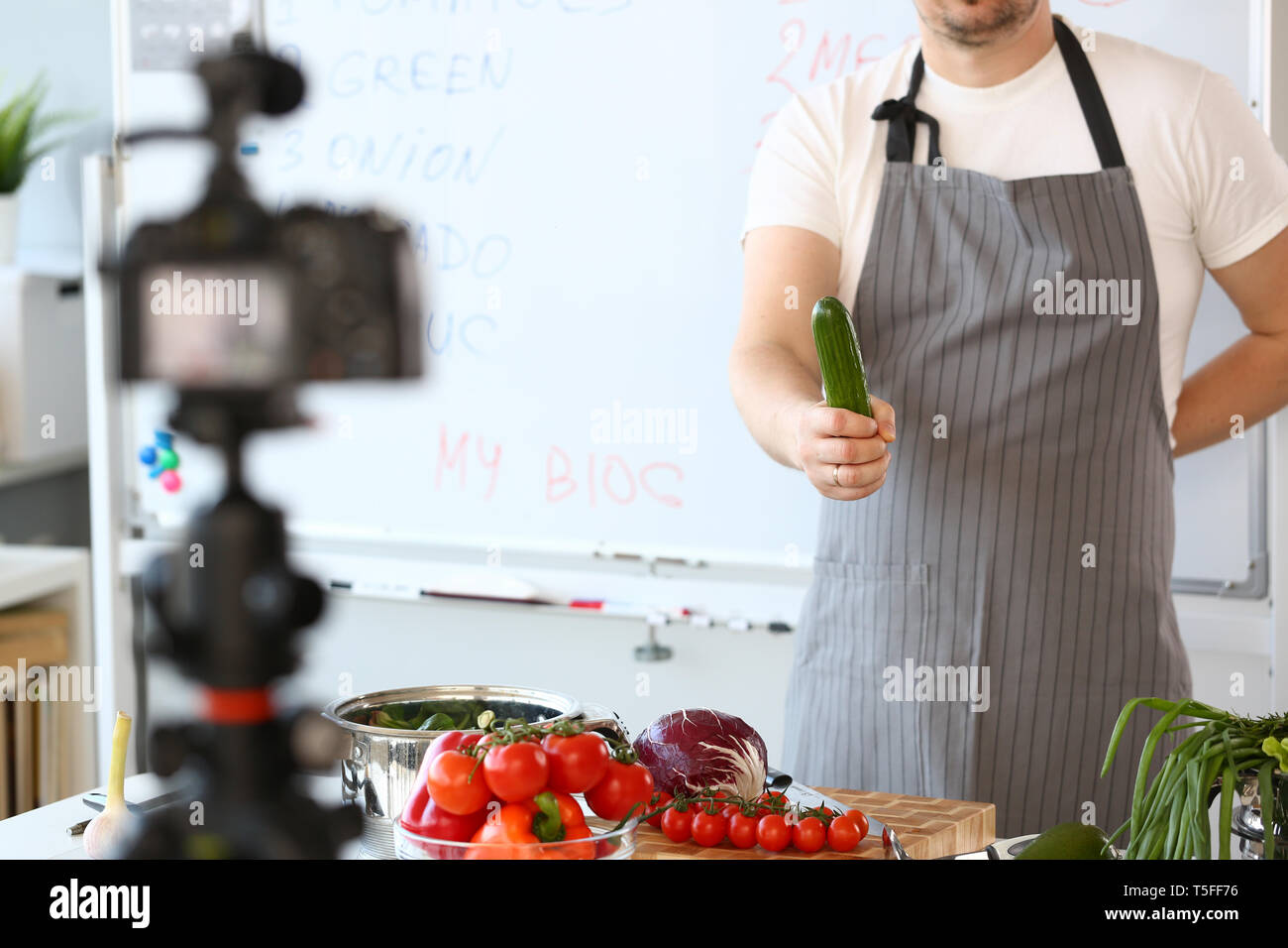 Kitchen vlogger holding green hi-res stock photography and images - Alamy