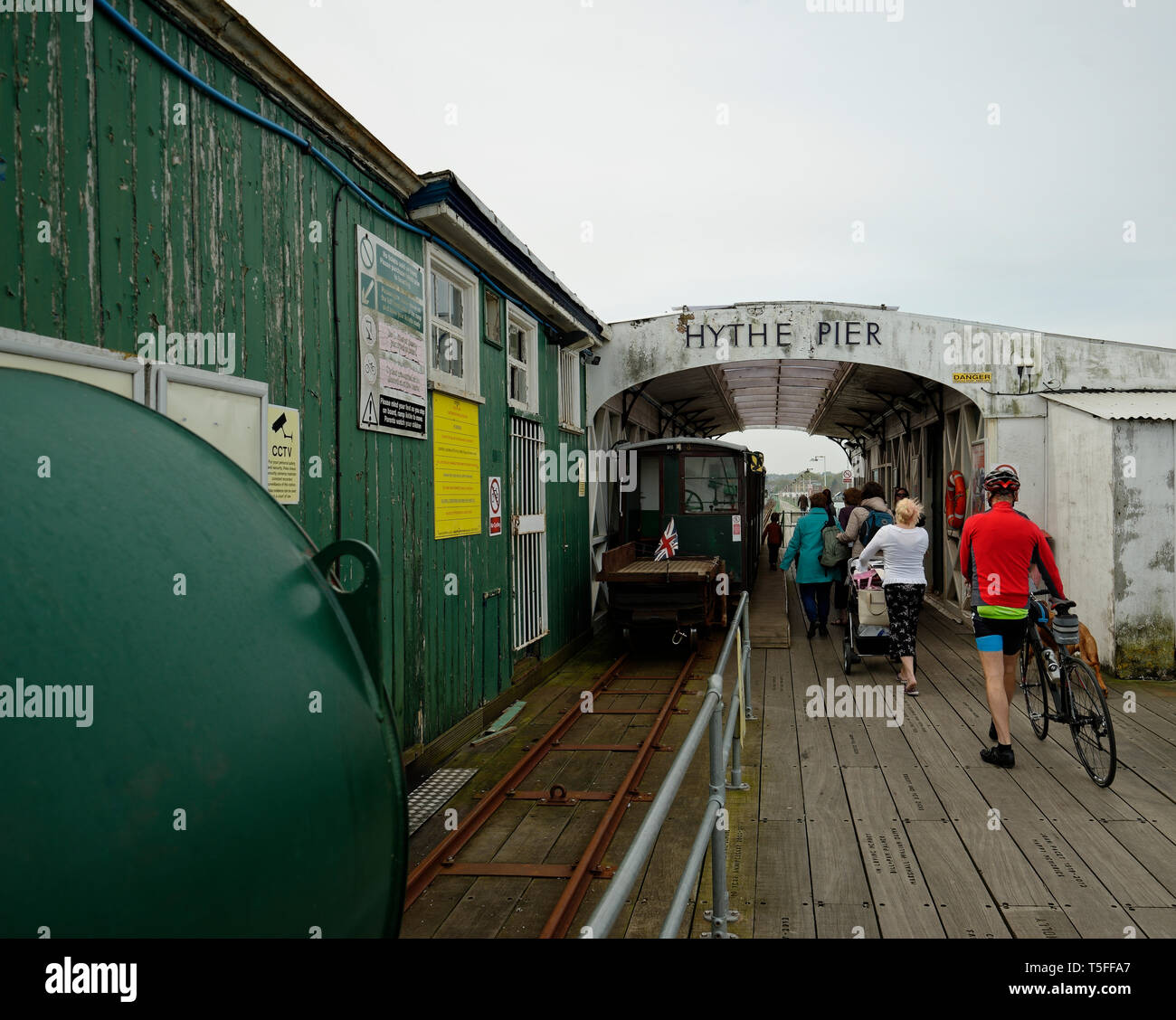 Passengers about to baord the Hythe electric train on Hythe Pier Stock ...
