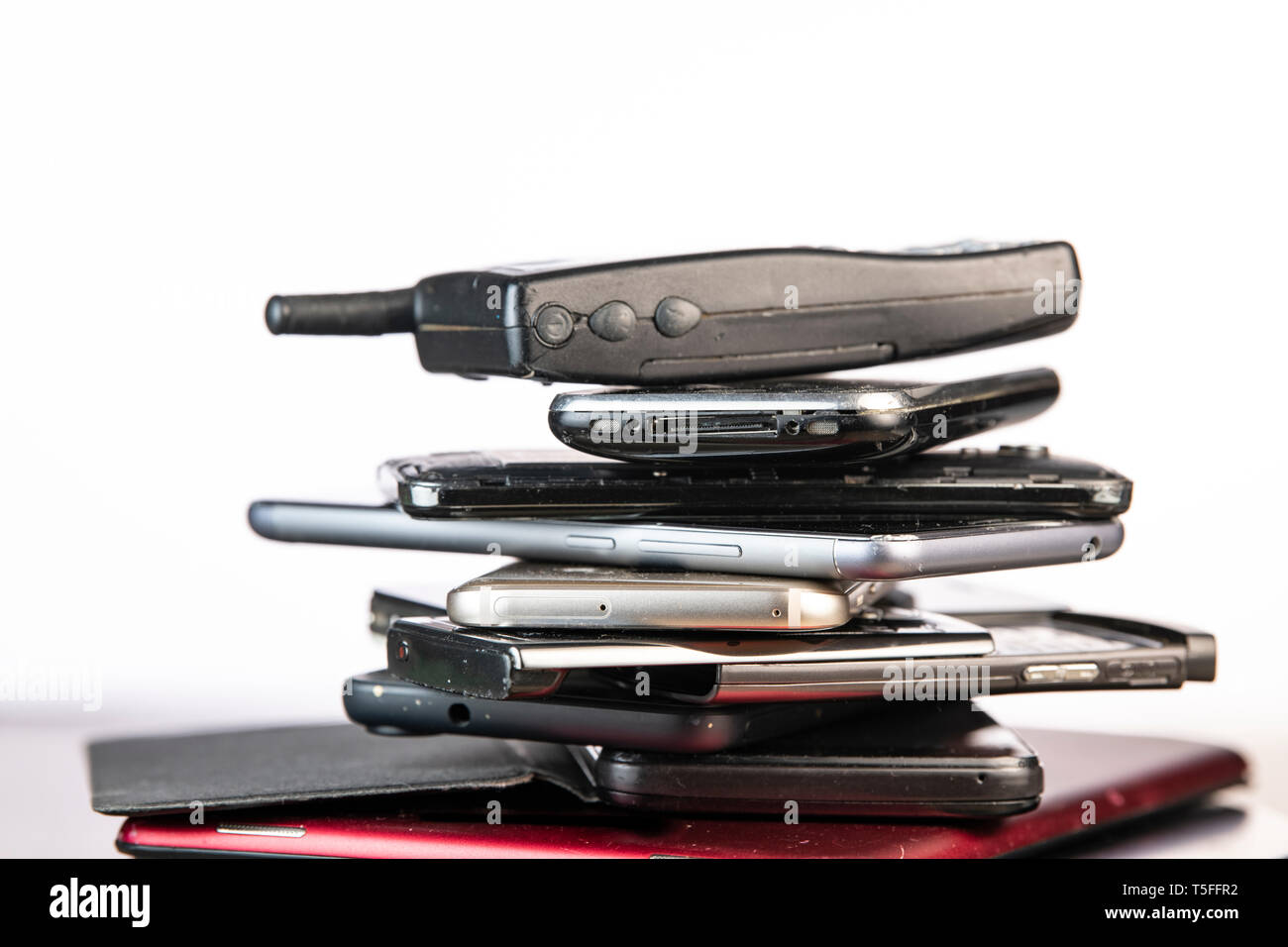 Old, broken and obsolete cellphone on wood background, France Stock ...