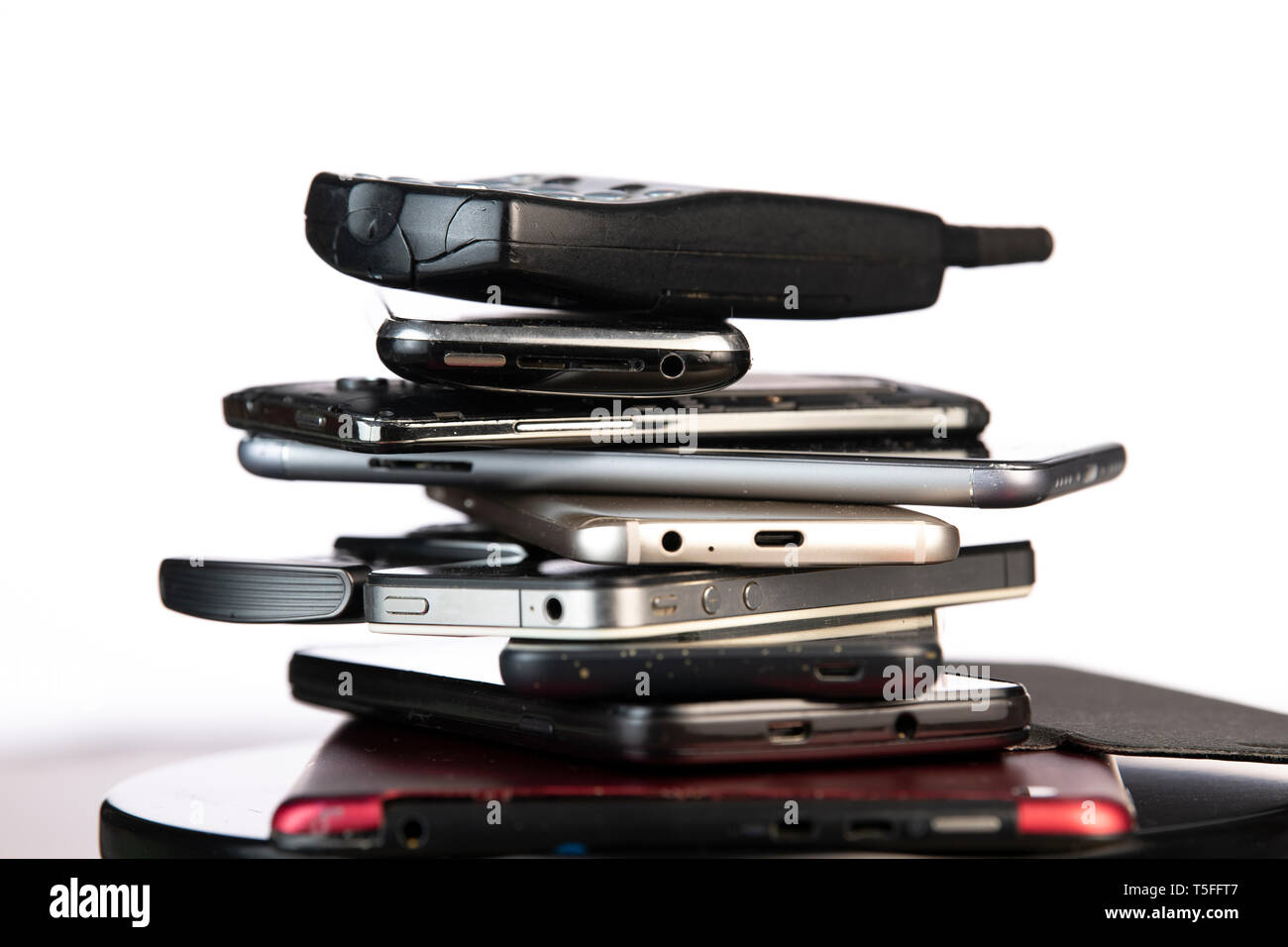 Old, broken and obsolete cellphone on wood background, France Stock ...