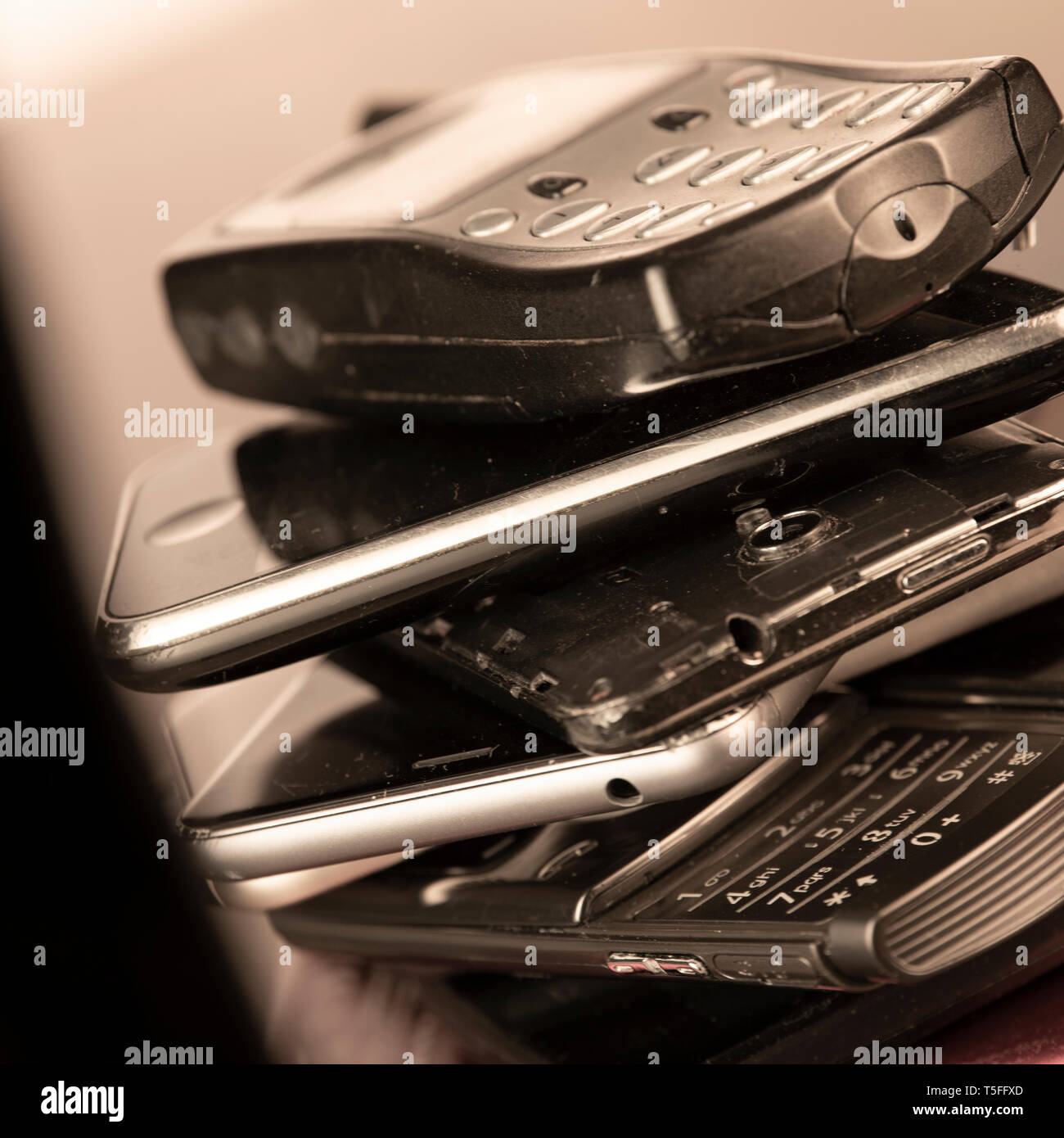 Old, broken and obsolete cellphone on wood background, France Stock ...