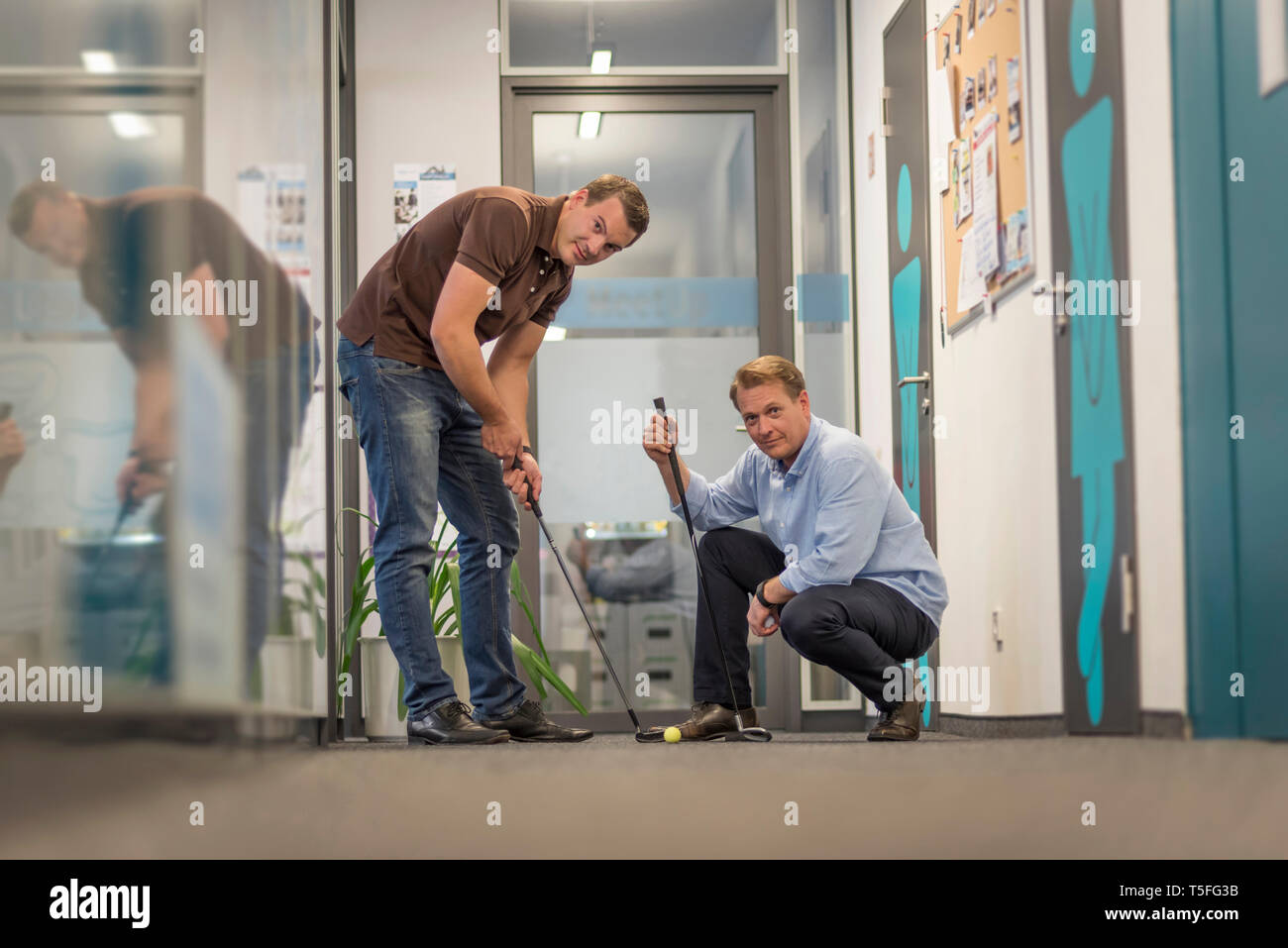 Playing golf at office hi-res stock photography and images - Alamy