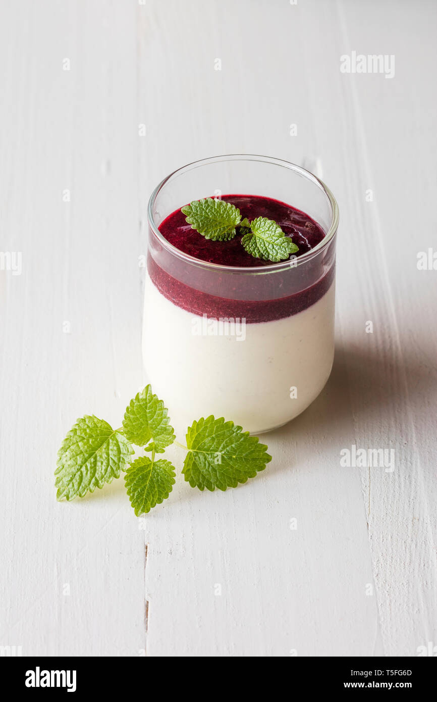 Panna cotta with berry sauce Stock Photo - Alamy