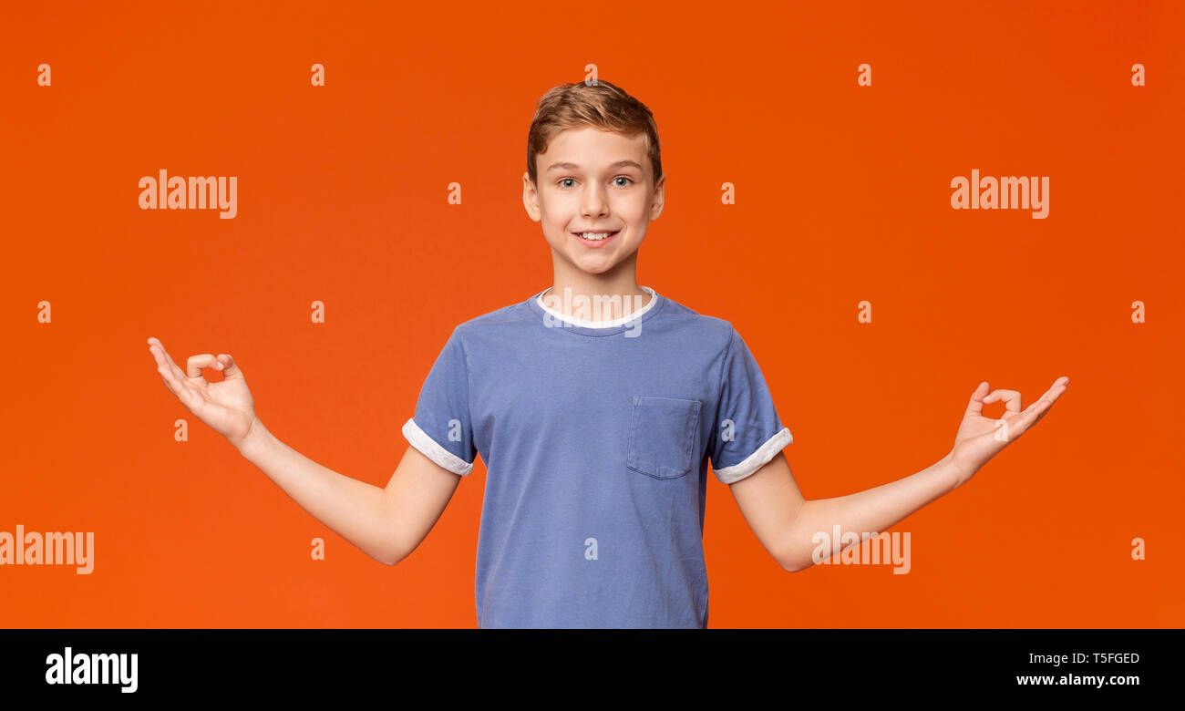 Peaceful calm little boy meditating and smiling Stock Photo - Alamy