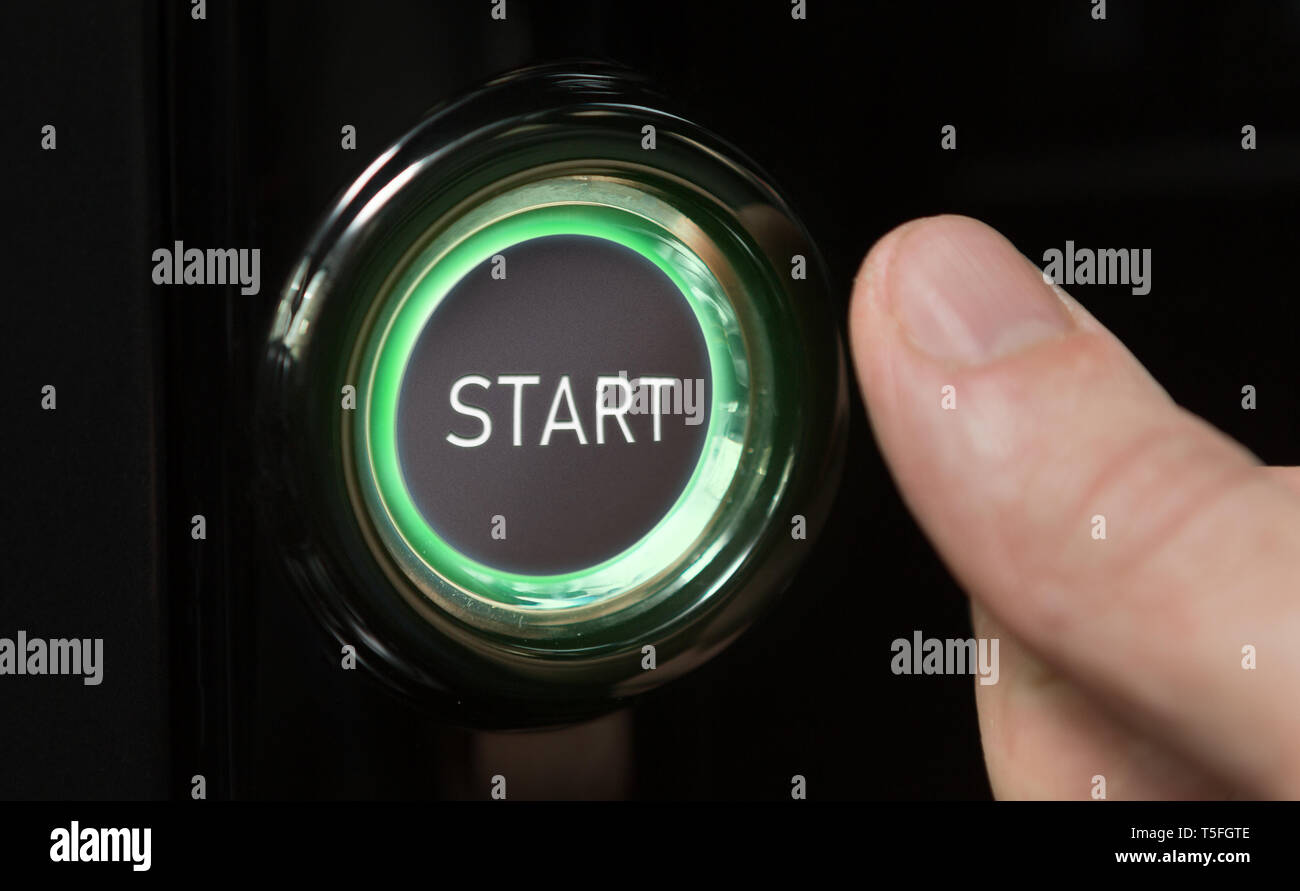 Man pushing green lighted button with word Start Stock Photo - Alamy Man pushing green lighted button with word Start Stock Photo - Alamy