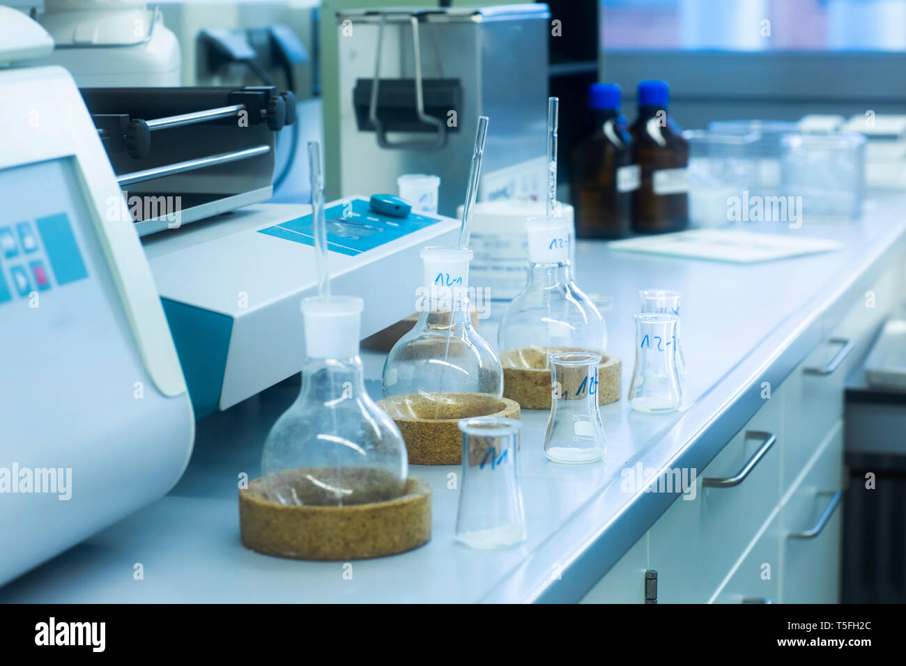 Laboratory glassware on table in lab Stock Photo - Alamy