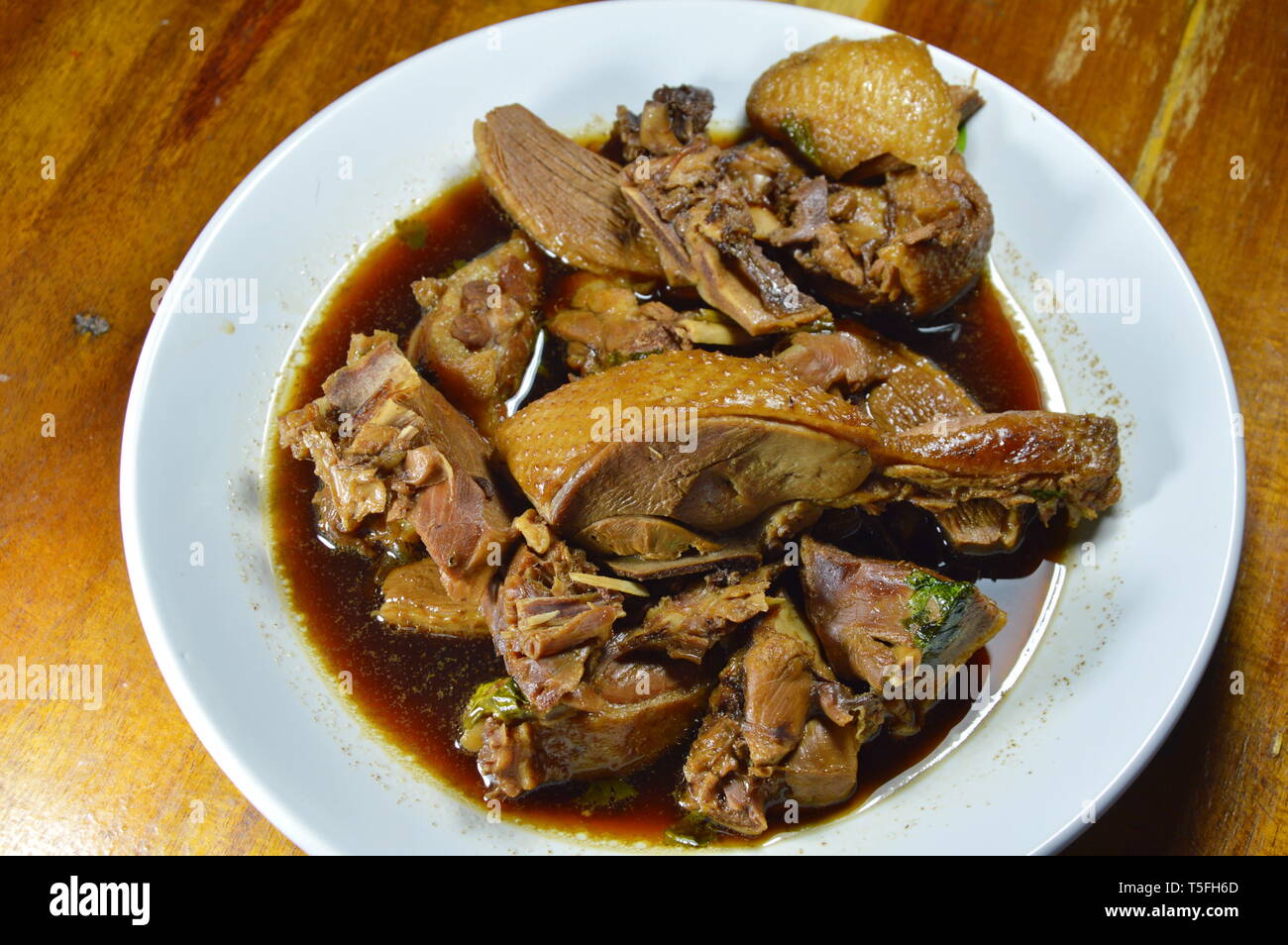 steamed duck meat in Chinese brown soup on plate Stock Photo - Alamy