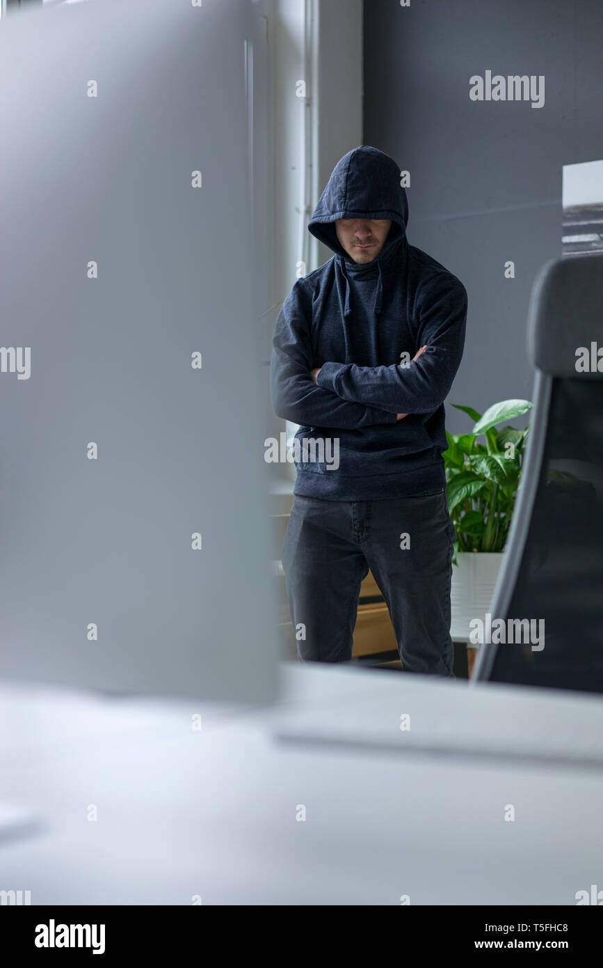 Anonymous teenager hacking PC Stock Photo - Alamy