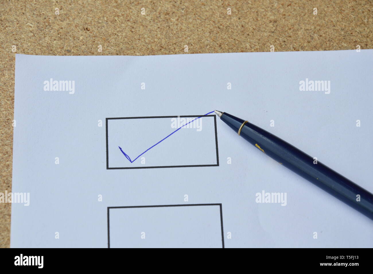 pen filled correct sign in the blank on white paper Stock Photo - Alamy