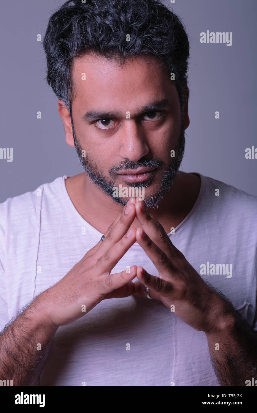 Indian man serious hi-res stock photography and images - Alamy