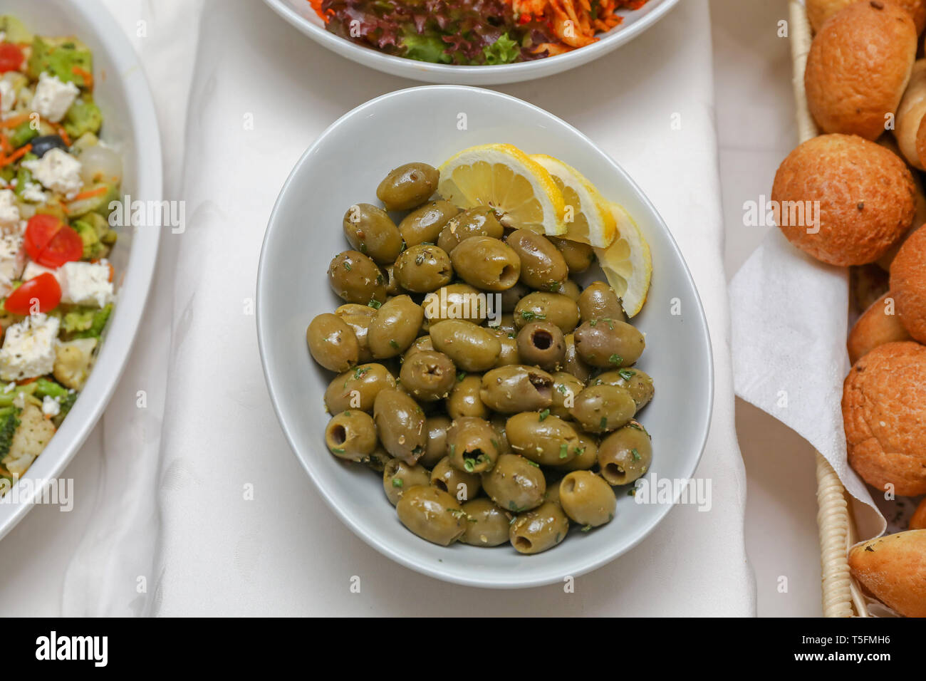 Pickled Green Olives Served in Bowl at Buffet Table Stock Photo - Alamy