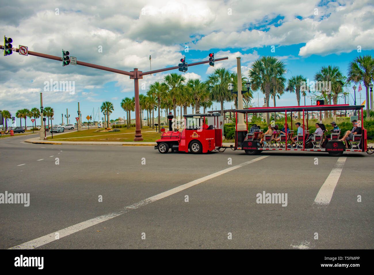 St. Augustine, Florida. March 31 , 2019 . Red Train Tour and palm trees ...