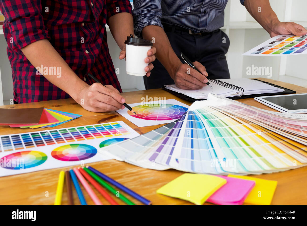 Graphic designers choose colors from the color bands samples for design ...