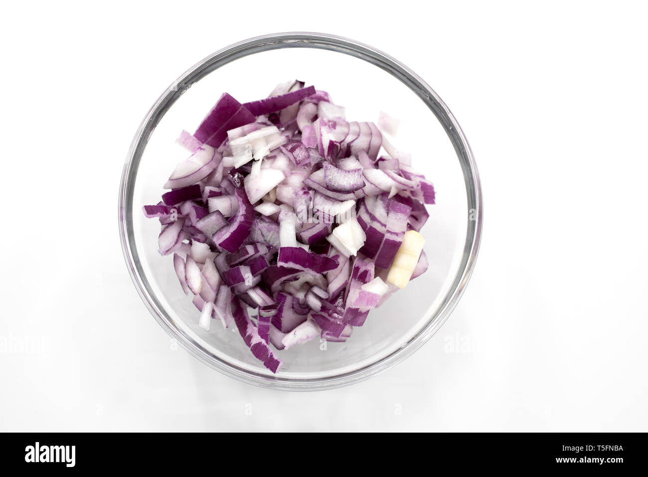 Sliced and diced red onion in a glass bowl Stock Photo - Alamy
