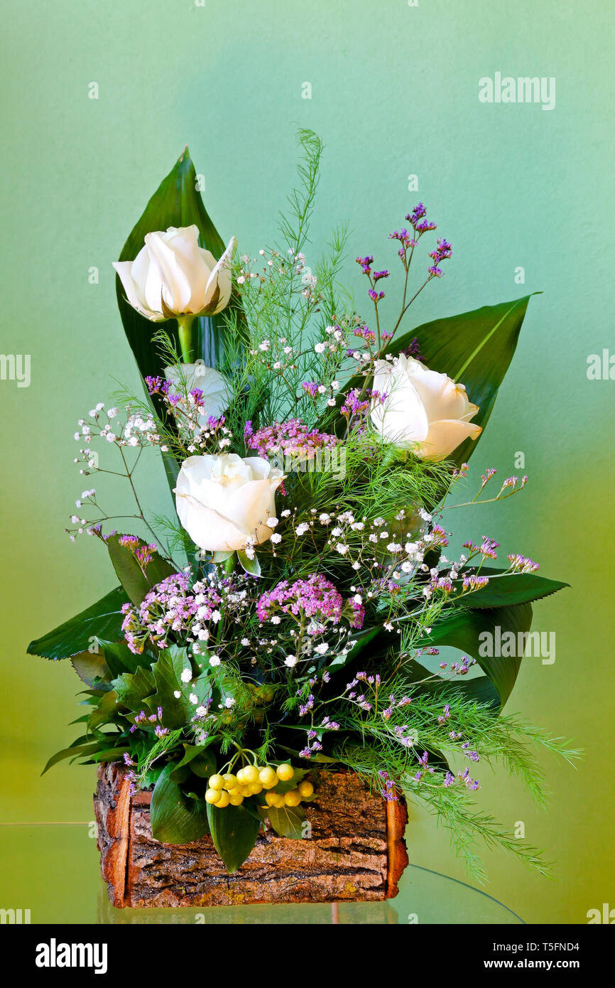 Three white roses in weeding flower arrangement Stock Photo - Alamy