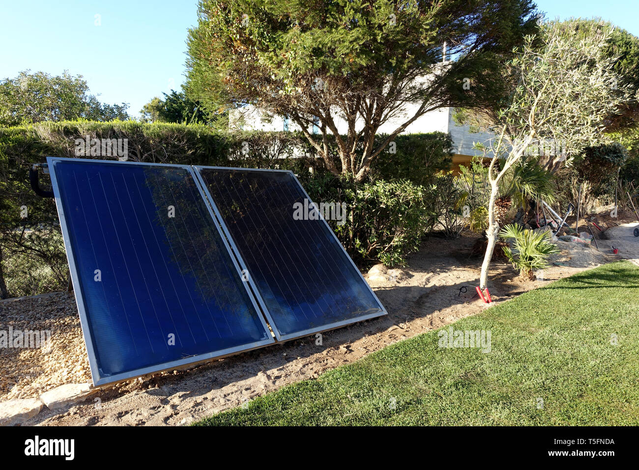 Solar panels in front garden of house Stock Photo - Alamy